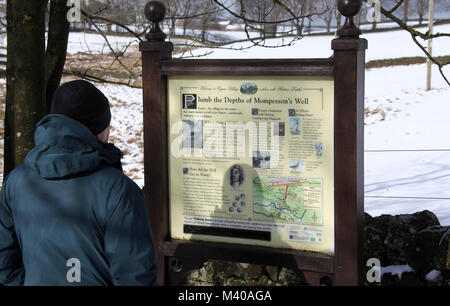 Tourist information board at Mompessons Well at Eyam Stock Photo - Alamy