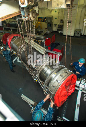 Sailors load F414-GE-400 jet engine onto test cell trailer aboard ...