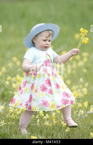 Ivy Mitchell enjoys the Easter weather as she runs around the meadow ...
