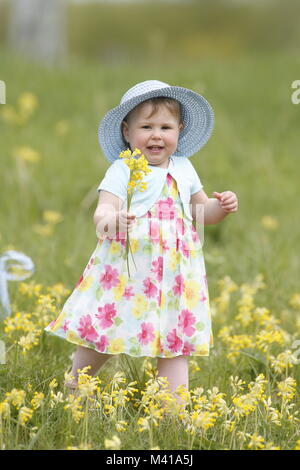Ivy Mitchell enjoys the Easter weather as she runs around the meadow ...