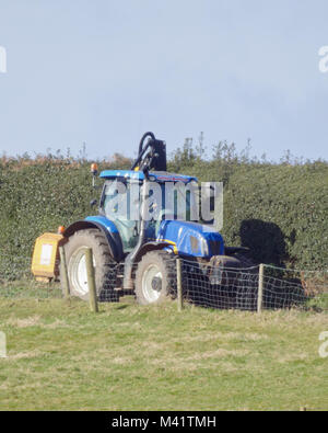 Tractor hedge cutting cutter Uk Stock Photo - Alamy