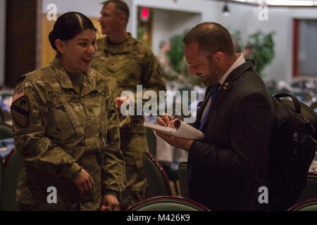 Guest speaker Chad Robichaux greets a Soldier after the conclusion of ...