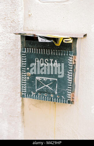 Old dark green mailbox on a green wooden surface at San Francisco ...