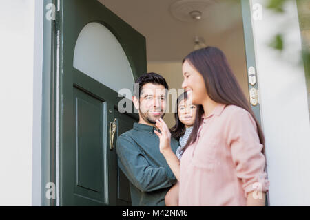 Caucasian father waving goodbye to his family before going to work ...
