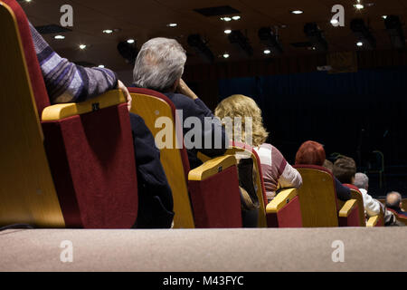 A full theatre audience sitting in auditorium watching a play ...