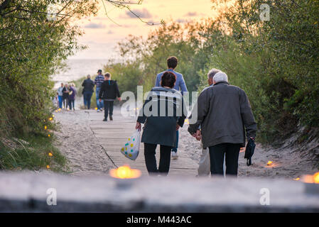 Romantic bonfire night at seaside during sunset. People gathering ...