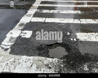 A pothole at an intersection in the Chelsea neighborhood in New York on ...
