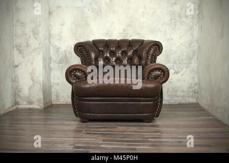 Leather vintage furniture in classic interior with wooden parquet floor ...