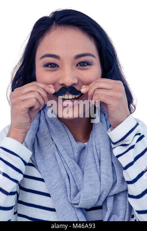 Pretty Asian woman with fake mustache posing for camera Stock Photo - Alamy