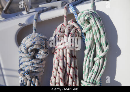 Sailing yacht deck with railings and ropes. Boat trip at sunny summer ...