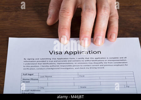 Person Hand On Visa Application Form Stock Photo - Alamy