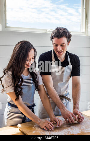 Couple baking together Stock Photo - Alamy