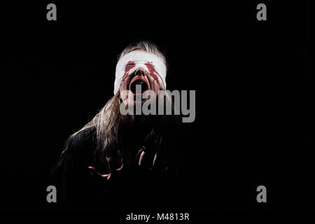scared bloody girl screaming on black background with copyspace Stock ...