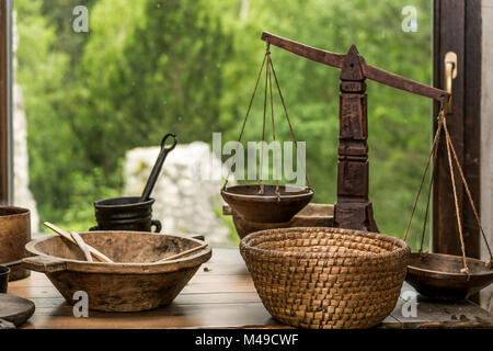 Medieval kitchen with tools, baskets, scale, fireplace Stock Photo ...