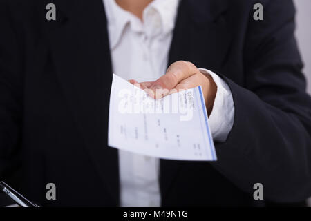 Close-up Of A Businessperson's Hand Giving Cheque To Colleague Stock ...