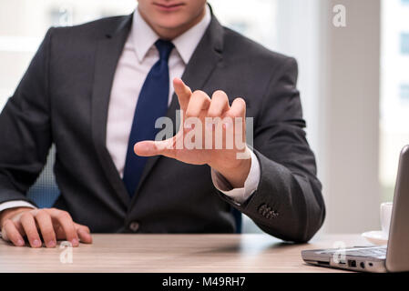 Young businessman pressing buttons in business concept Stock Photo - Alamy
