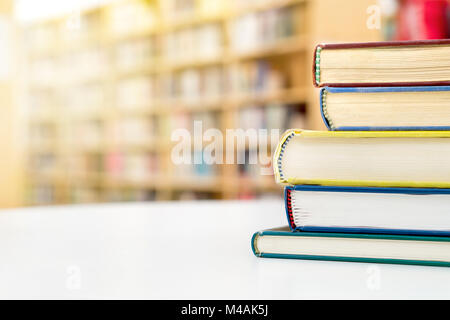 pile of books in a public library Stock Photo - Alamy