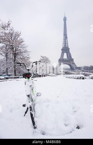Snow in Paris. Snowman. Trocadéro Square. An elderly man carefully ...