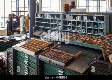 Typesetter at work in the composing room at printing business at MIAT ...