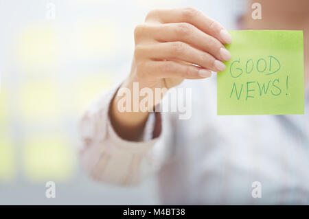 Good news text on adhesive paper Stock Photo - Alamy