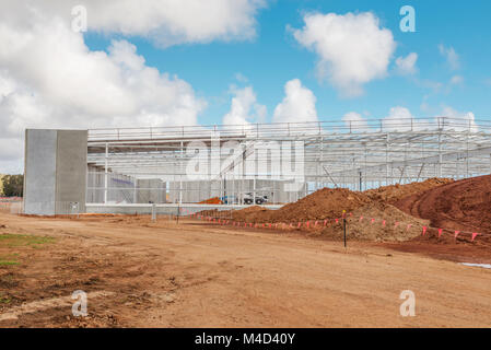 building site with red framework of warehouse being built Stock Photo ...