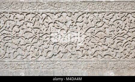 Traditional ornate plaster work and mosaic tiles with carved wooden ...