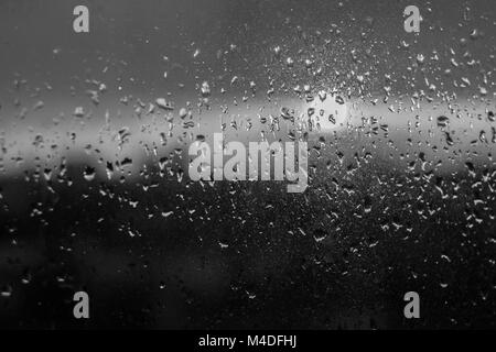 Unfocuced sun and water drops on the window Stock Photo - Alamy