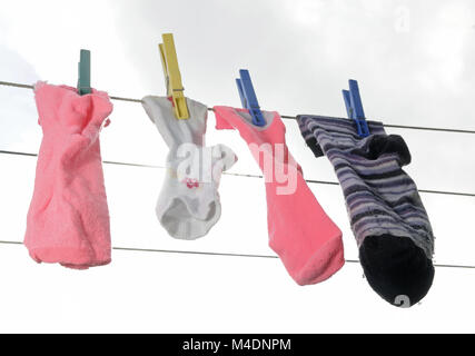 Stockings hanging on clothesline Stock Photo - Alamy