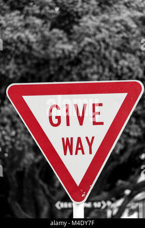 Give way sign on asphalt, detail of a traffic signal at the ciduad ...