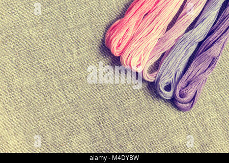 Set for embroidery with thread violet color Stock Photo - Alamy