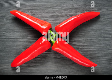 Sweet red Kapia peppers on a white wood background Stock Photo - Alamy