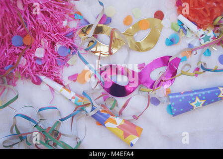 Streamers, party horns, masks and confetti Stock Photo - Alamy