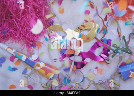 Streamers, party horns, masks and confetti Stock Photo - Alamy