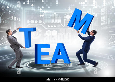 Teamwork concept with businessman putting letters Stock Photo - Alamy