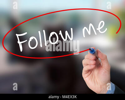 Man Hand writing Follow Me with marker on visual screen. Business ...