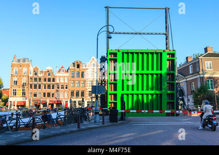 The Scharrebiersluis drawbridge opening to allow a barge into the ...