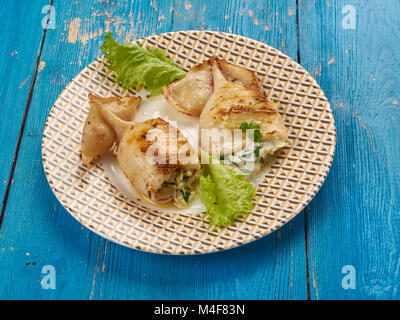 Gemisto Kalamari - Greek dish, stuffed squid with feta and cilantro ...