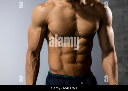 A fitness model's chiseled torso. Close up. Side view Stock Photo ...