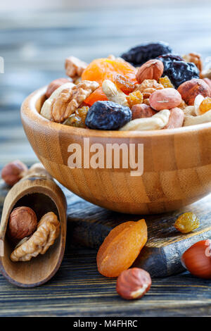 Various dried fruits and nuts on a kitchen table. Copy space Stock ...