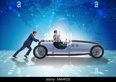 The businessman car pushing in teamwork concept Stock Photo - Alamy