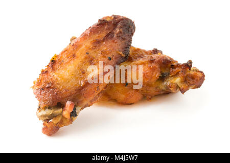 Chicken wings baked on grill with fresh herbs, lemon on wooden ...