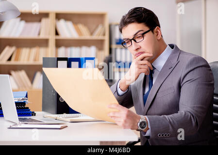 The businessman receiving letter envelope in office Stock Photo - Alamy