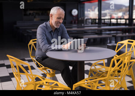 man with smartphone and tablet pc at smart home Stock Photo - Alamy
