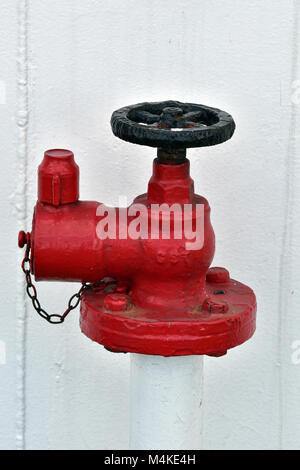 red fire hydrant with wheel valves Stock Photo - Alamy