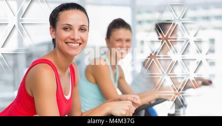 Athletic fit women in gym with health interface Stock Photo - Alamy