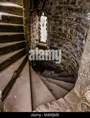 Stone spiral staircase in turret at Penhow Castle in Wales Stock Photo ...