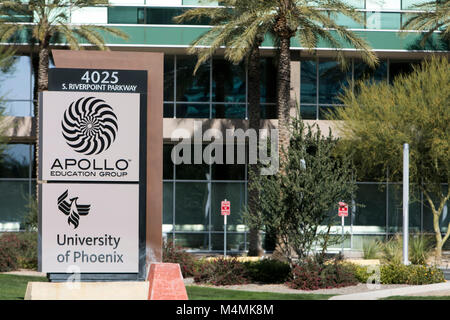 A logo sign outside of the headquarters of the Apollo Education Group ...