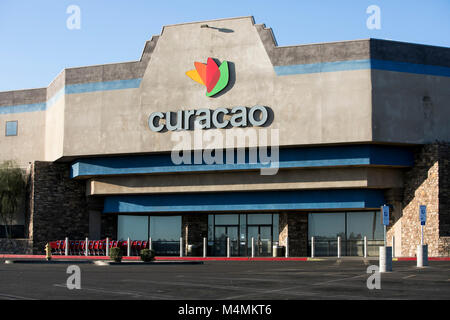 A logo sign outside of a Curacao retail store in Phoenix, Arizona, on ...