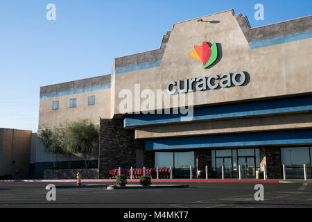 A logo sign outside of a Curacao retail store in Phoenix, Arizona, on ...