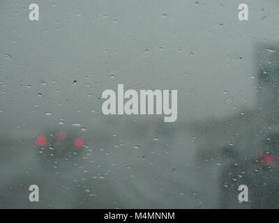 View on highway through wet window Stock Photo - Alamy